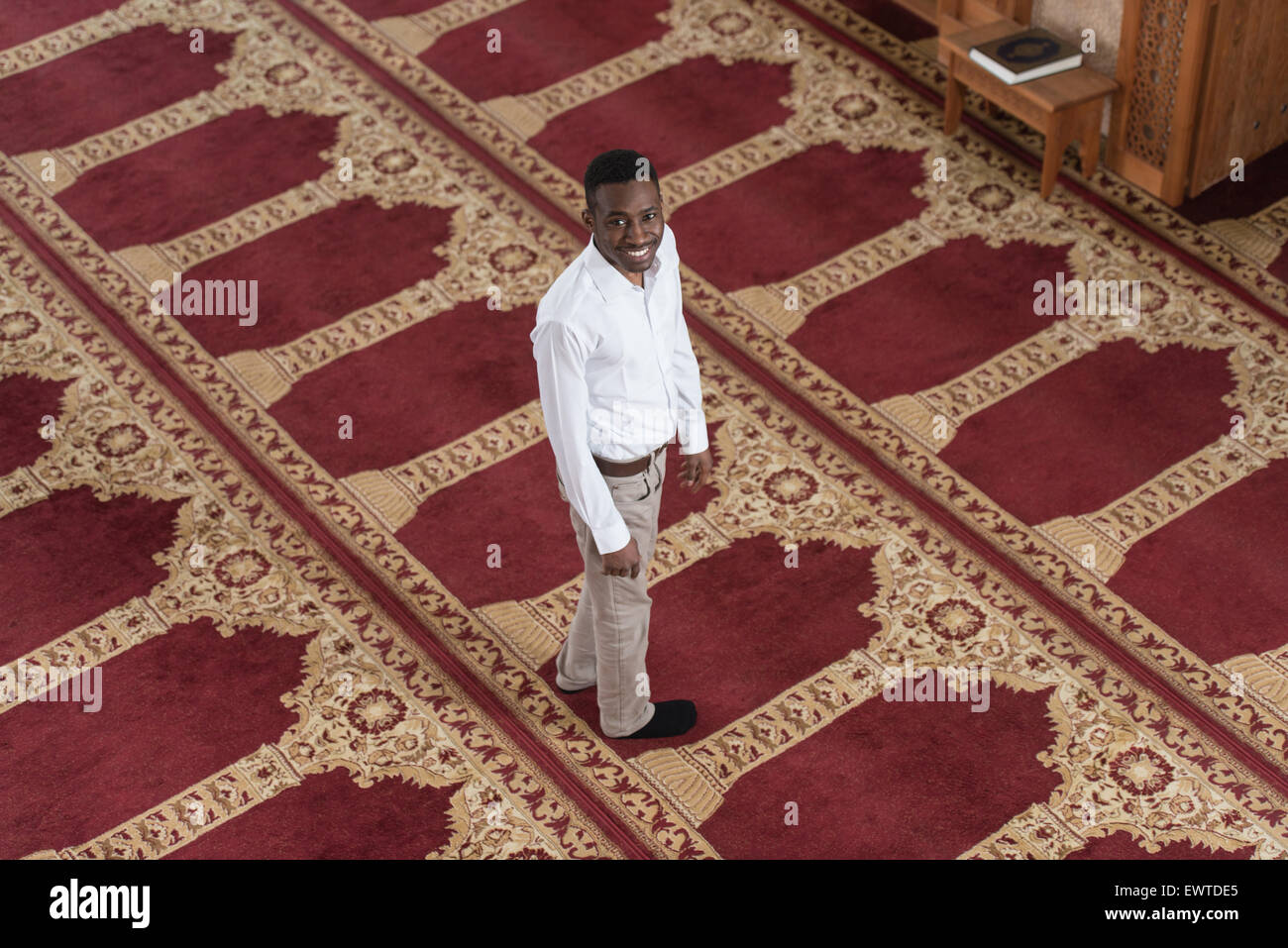 Handsome Black Man Smiling Is Praying In The Mosque Stock Photo - Alamy
