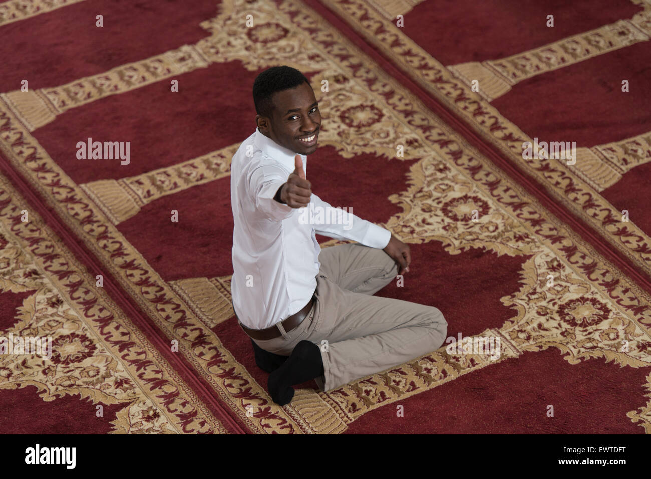 Black African Muslim Man Showing Thumbs-Up Stock Photo - Alamy