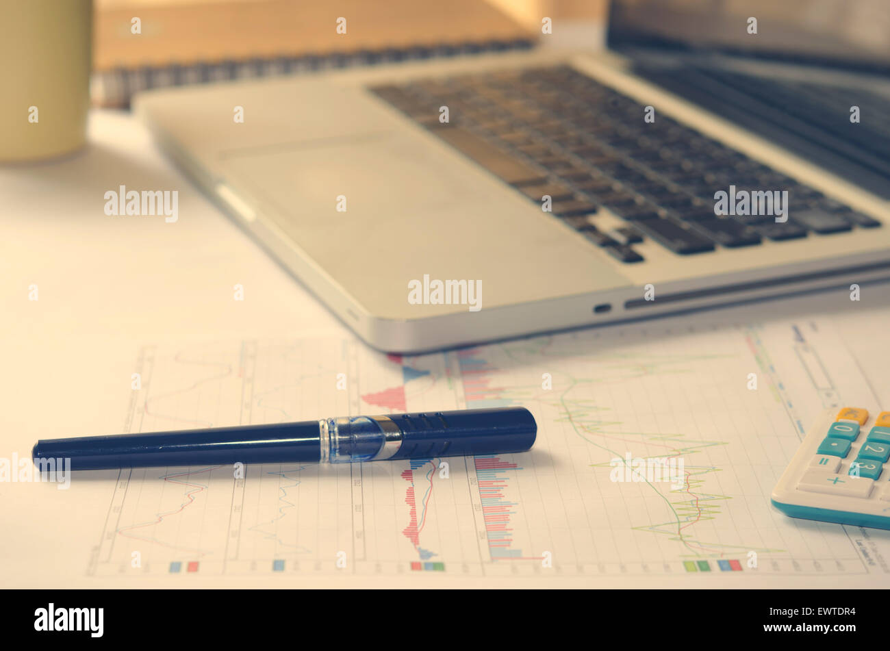 Notebook Computers ,book,pen on desk.vintage color tone Stock Photo - Alamy