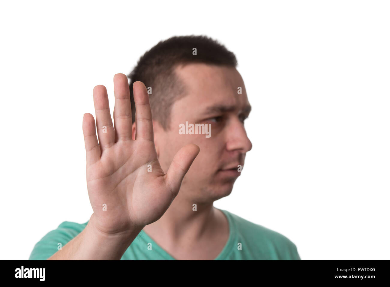 Portrait Of A Handsome Young Man Doing A Stop Symbol - Isolated Over ...