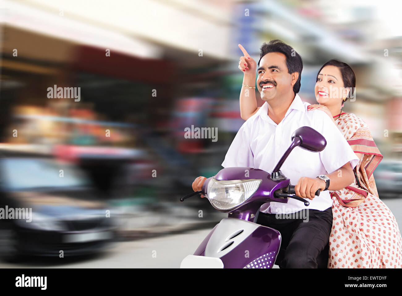 Women riding scooter at roads hi-res stock photography and images - Alamy