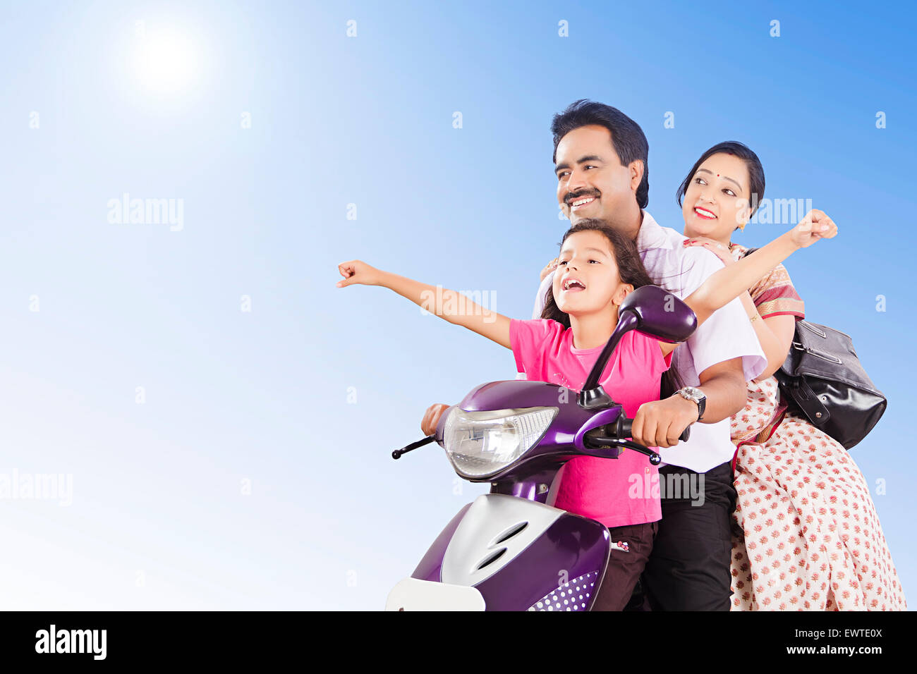 indian Parents and daughter Riding Scooty Stock Photo - Alamy