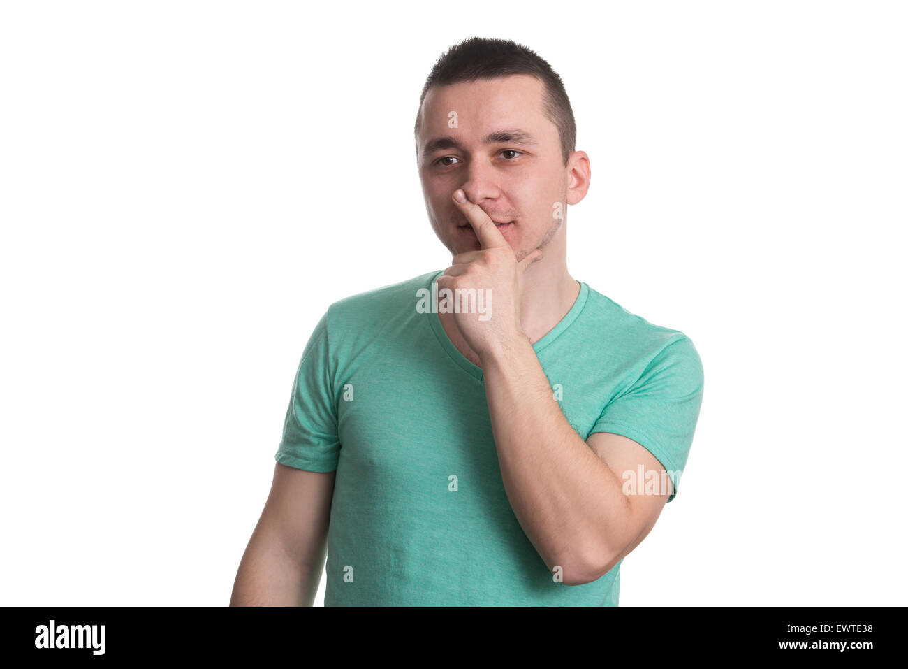 Portrait Of The Young Thinking Man Looks Up With Hand Near Face ...