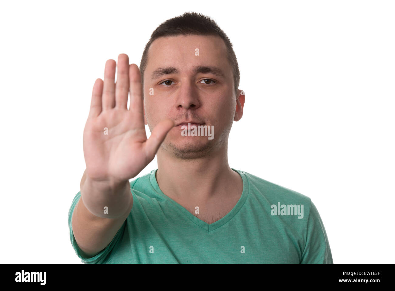 Portrait Of A Handsome Young Man Doing A Stop Symbol - Isolated Over ...