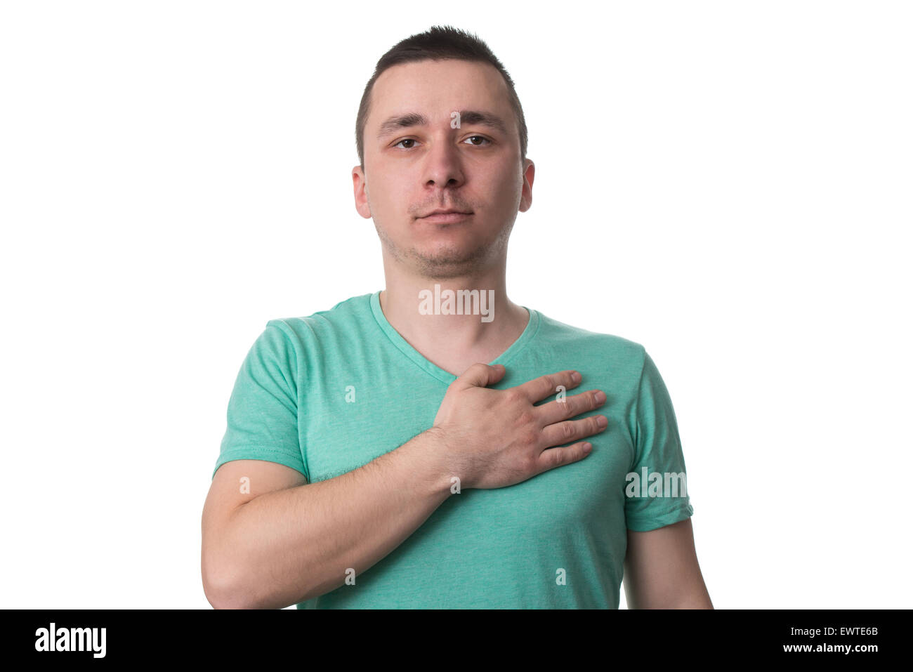 Man With His Hand On Heart Taking An Oath - Isolated On White ...