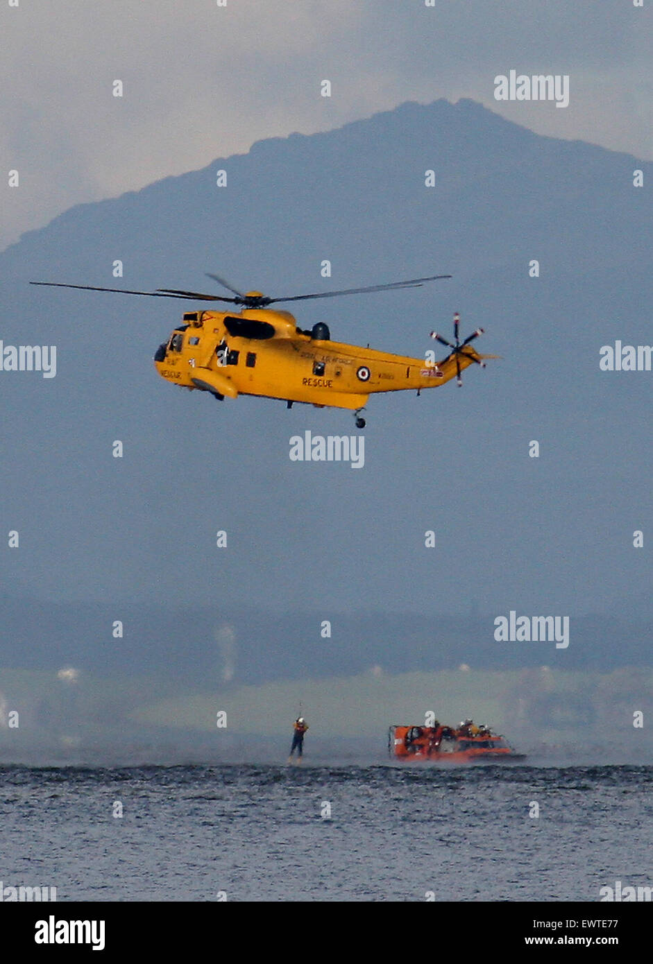 Sar helicopter winching exercise with rnli hovercraft hi-res stock ...