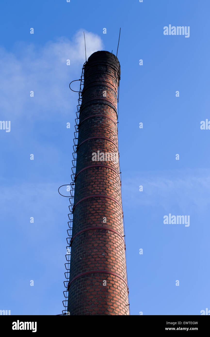Polluting white smoke coming out of chimney against blue sky Stock ...
