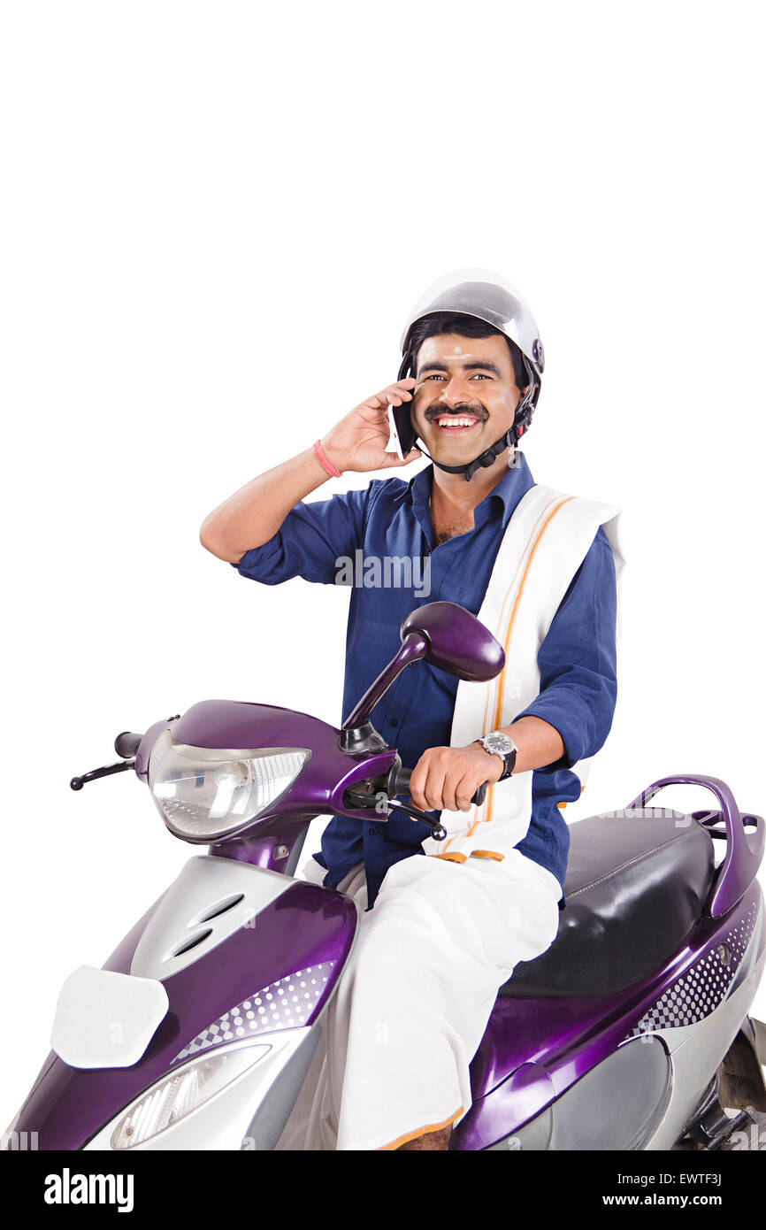 1 South Indian man Riding Scooty and talking Cell Phone Stock Photo - Alamy