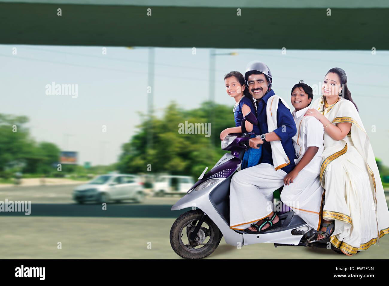 South Indian Parents and kids Riding Scooty Stock Photo - Alamy