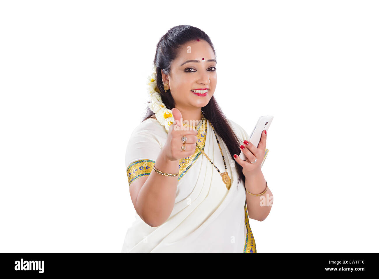 1 South Indian woman dialing Cell Phone and Thumbs Up showing Stock ...