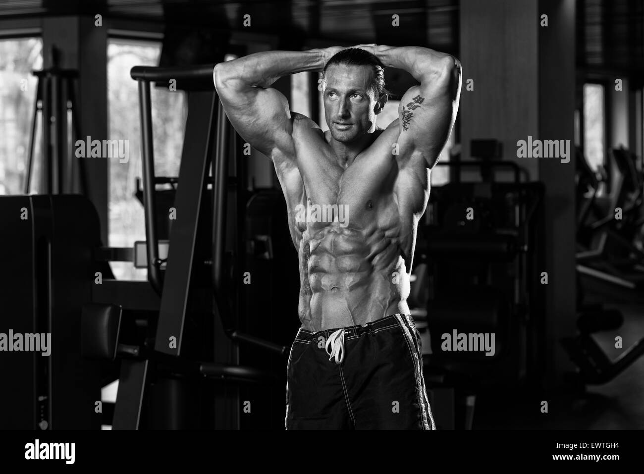 Portrait Of A Physically Fit Man In Modern Fitness Center - Black And ...