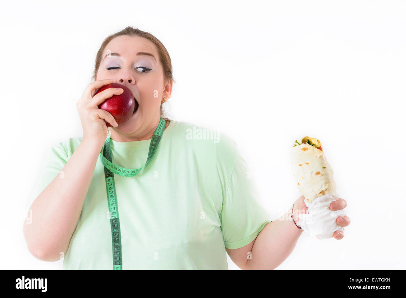 Corpulent woman struggle to eat healthy. Choosing healthy food Stock ...