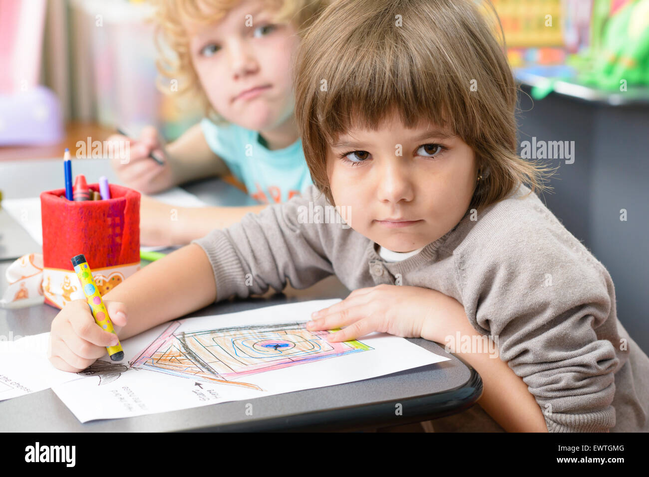 Two kids drawing at kindergarten Stock Photo - Alamy
