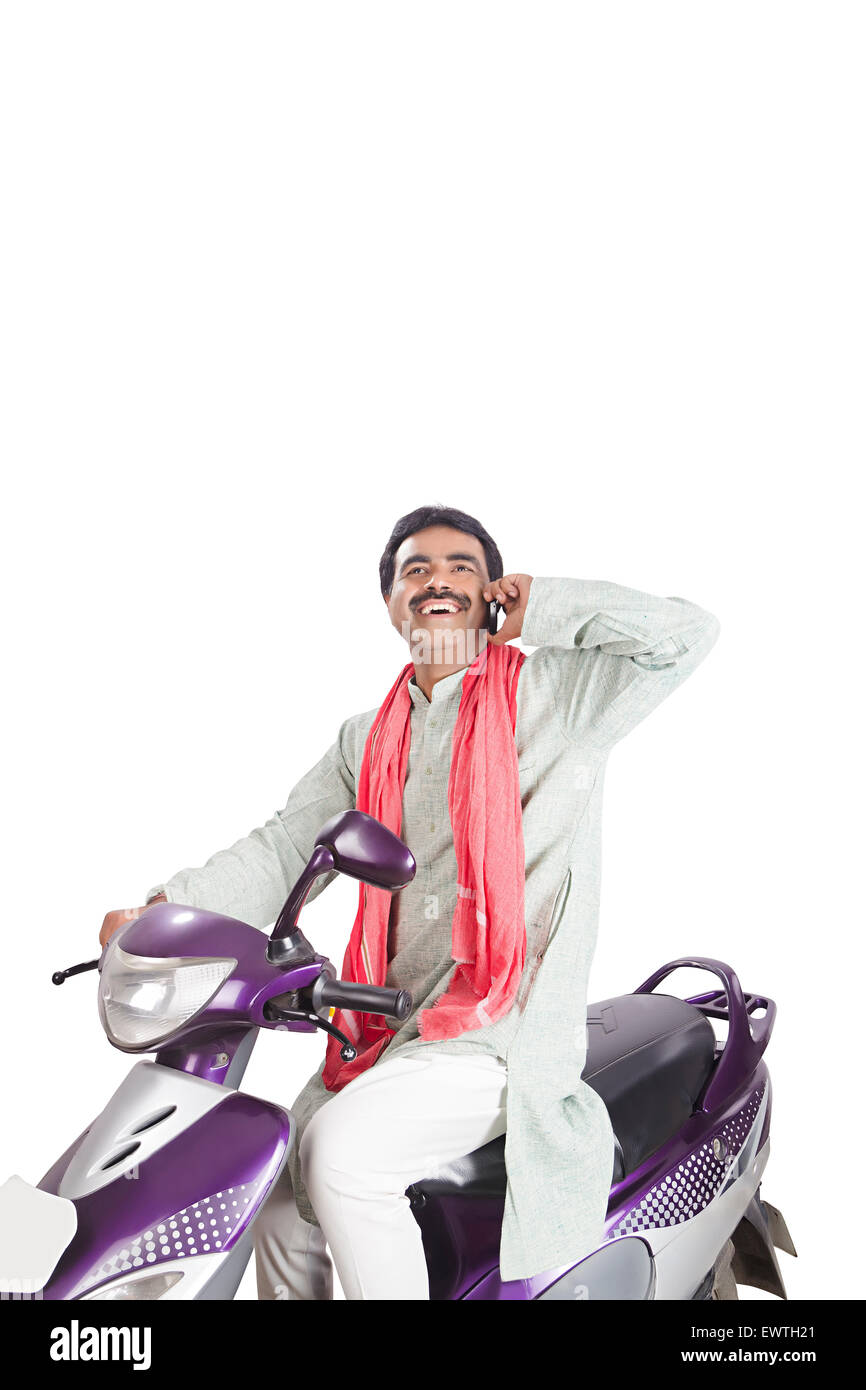 1 indian Rural man Riding Scooty and talking Cell Phone Stock Photo - Alamy