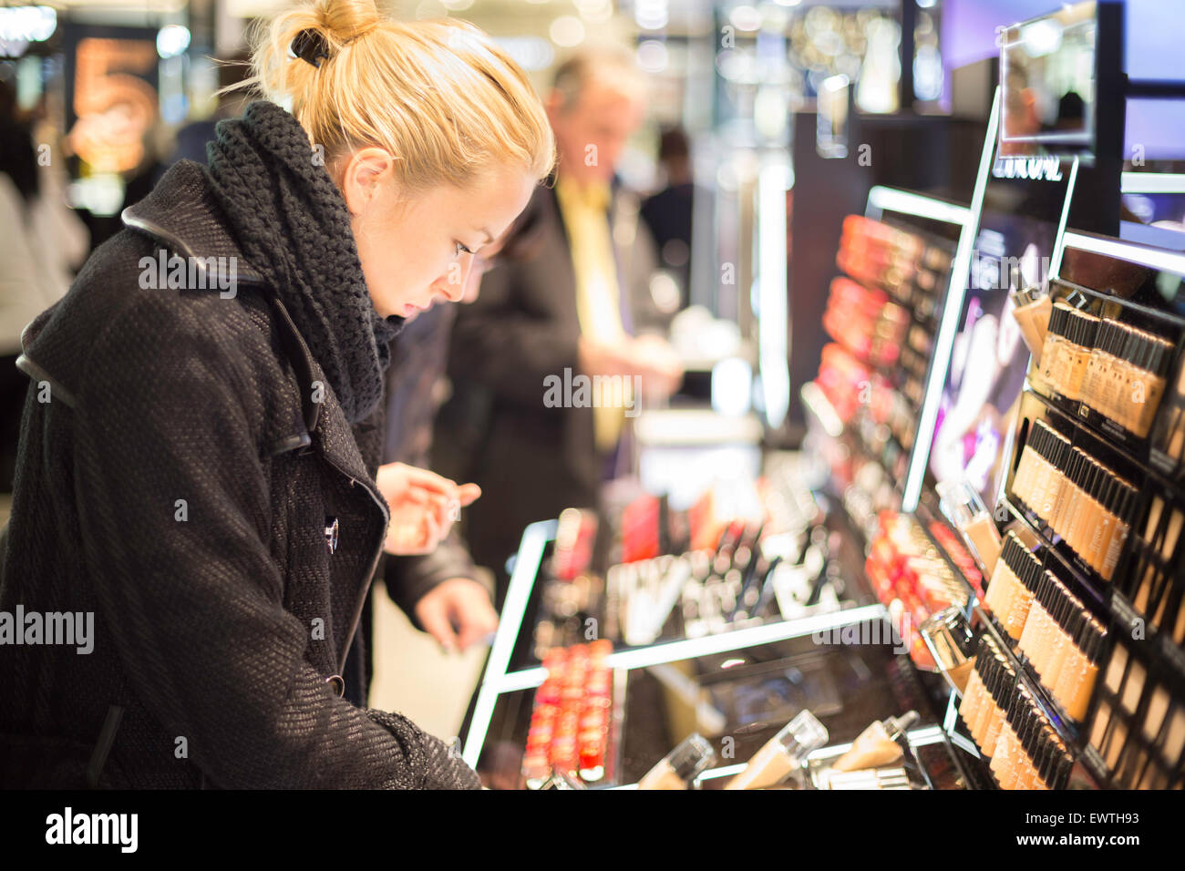Beautiful woman shopping in beauty store Stock Photo - Alamy
