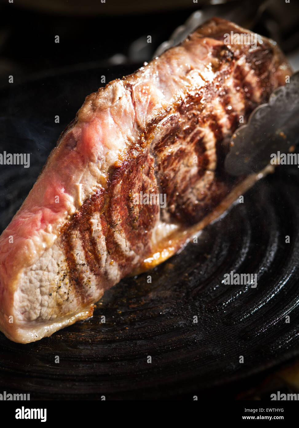 close up view on nice fresh steak is getting cooked Stock Photo - Alamy
