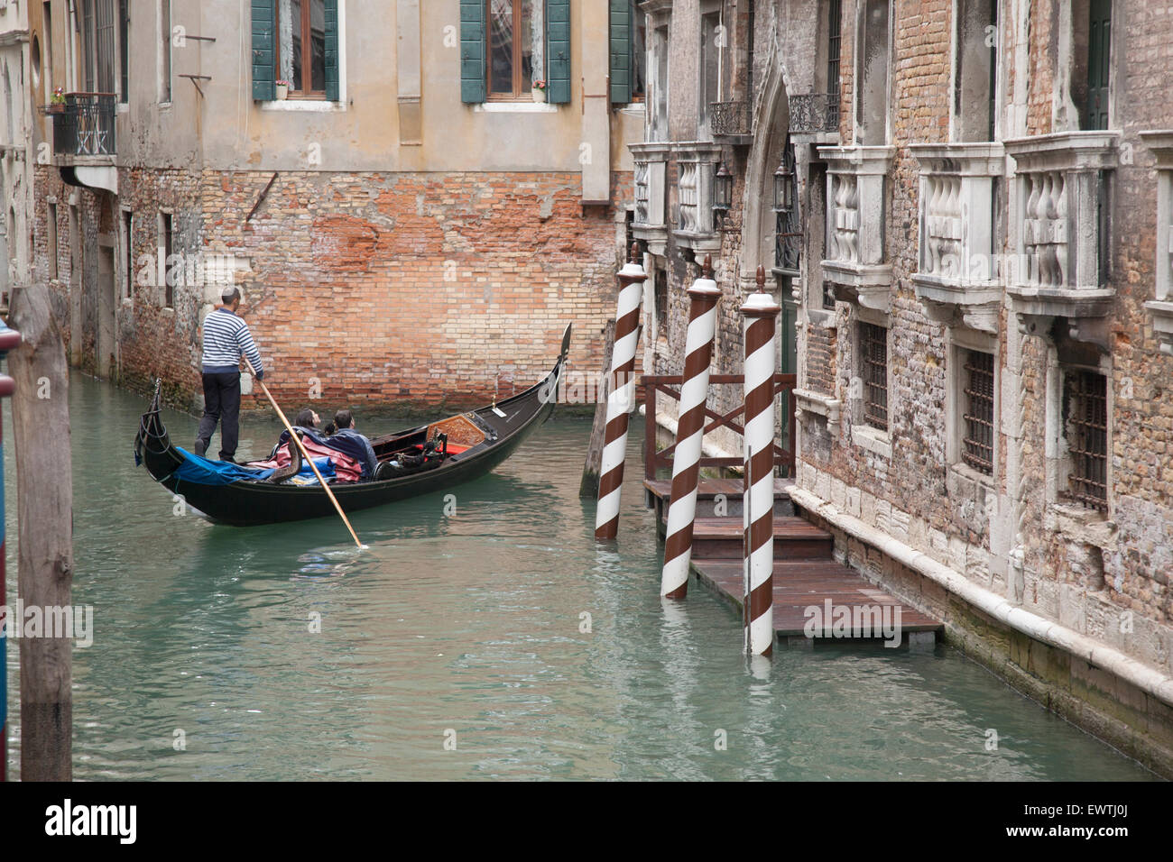 Traditional Venetian Gondola Boats on Canal, Venice; Italy Stock Photo ...