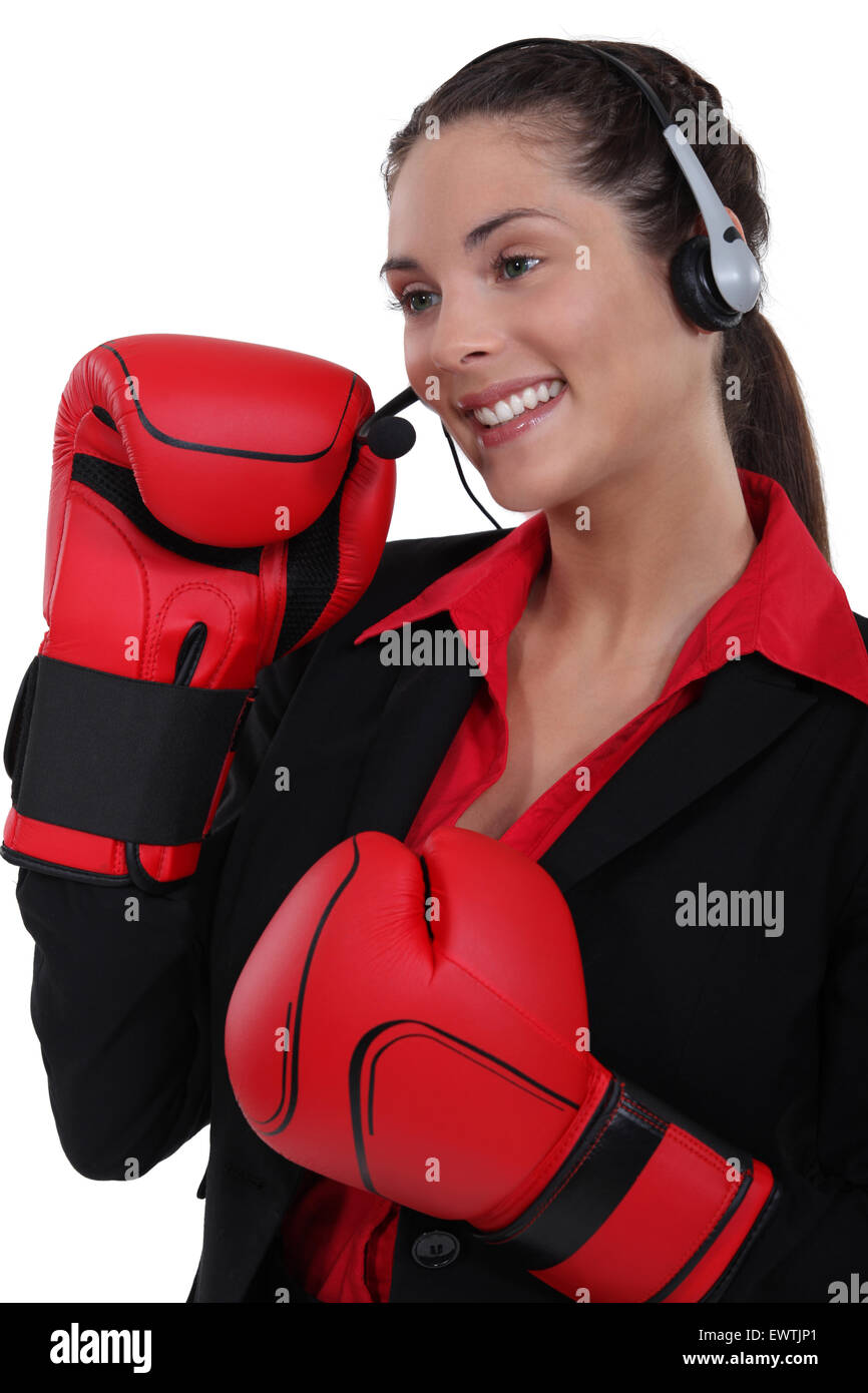 Customer service agent wearing boxing gloves Stock Photo - Alamy
