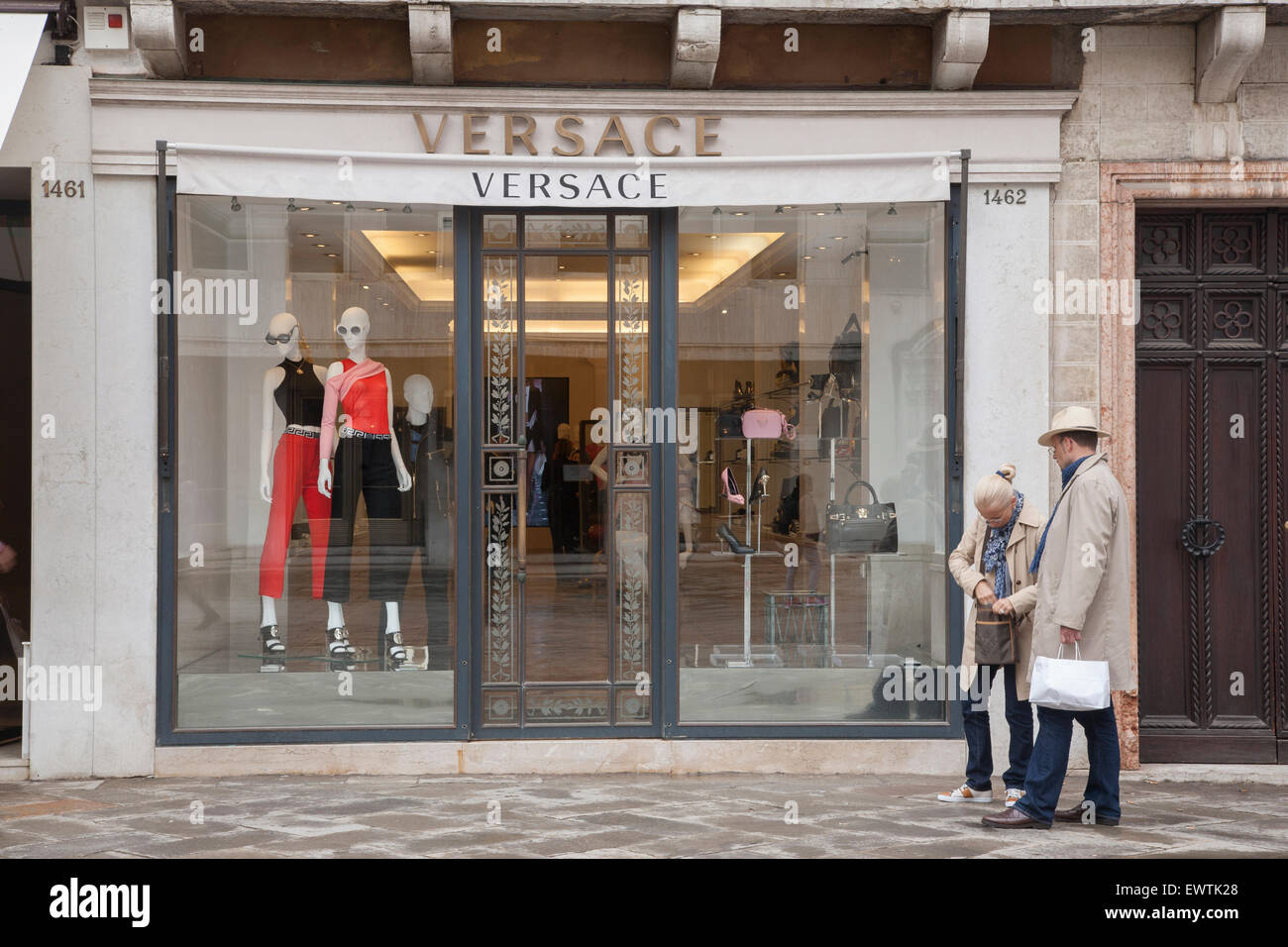 Versace Shop Window and Facade with Couple, Venice; Italy Stock Photo ...