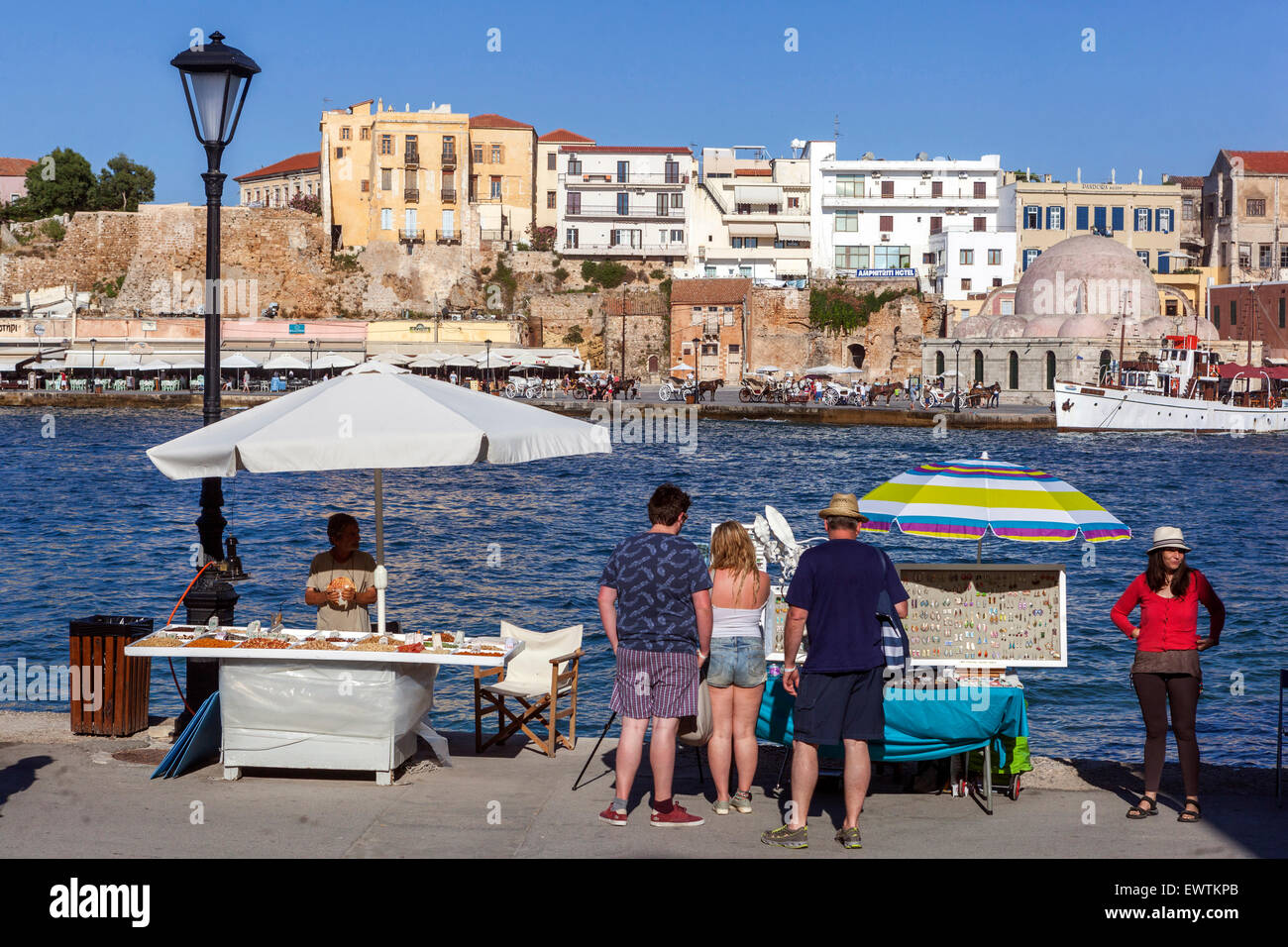 People on the waterfront in The Old Venetian harbour Chania Crete ...
