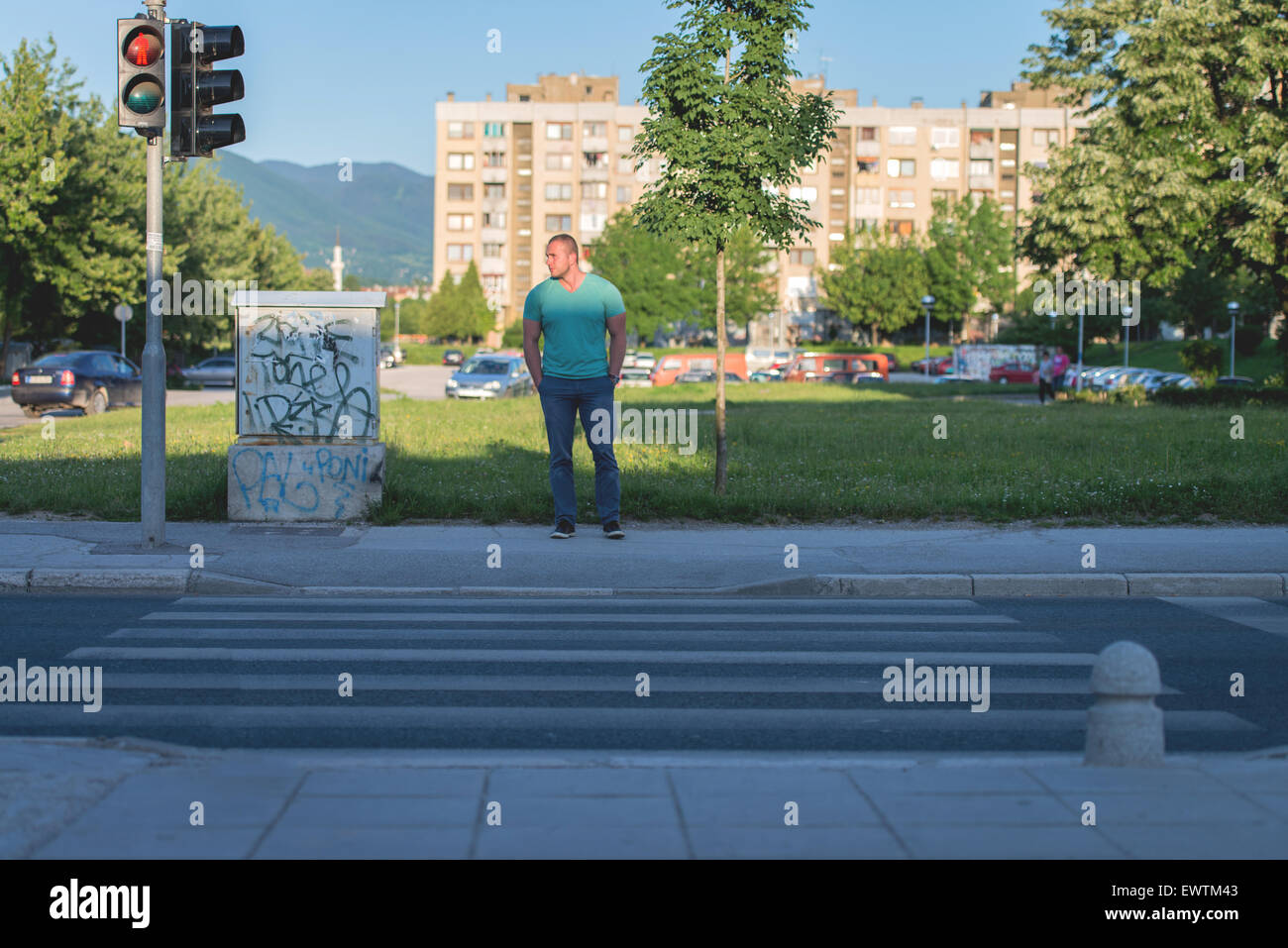 young man Waiting for green light Stock Photo - Alamy