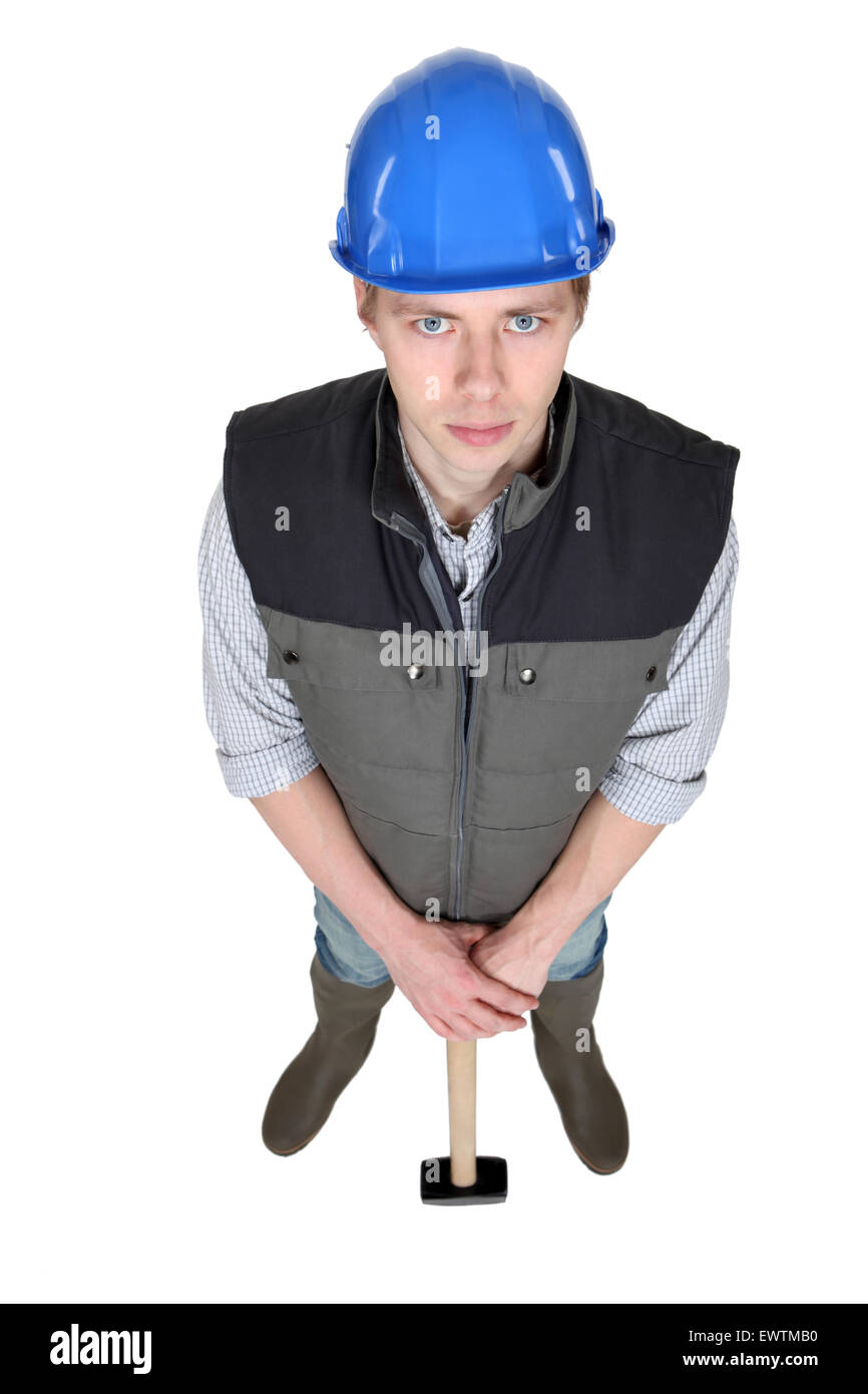 Man posing with sledge hammer Stock Photo - Alamy