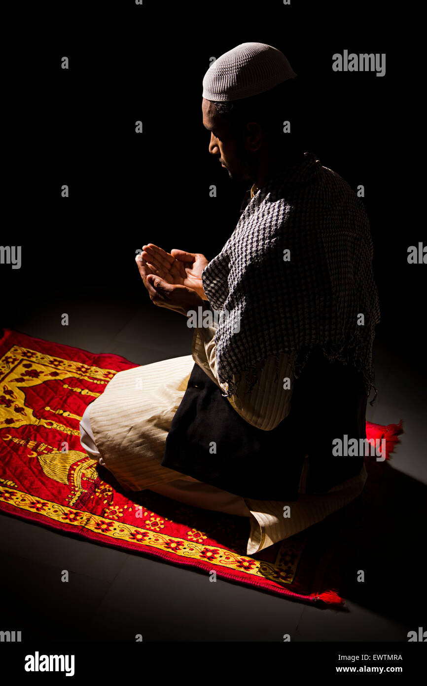 Muslim man offering prayers hi-res stock photography and images - Alamy