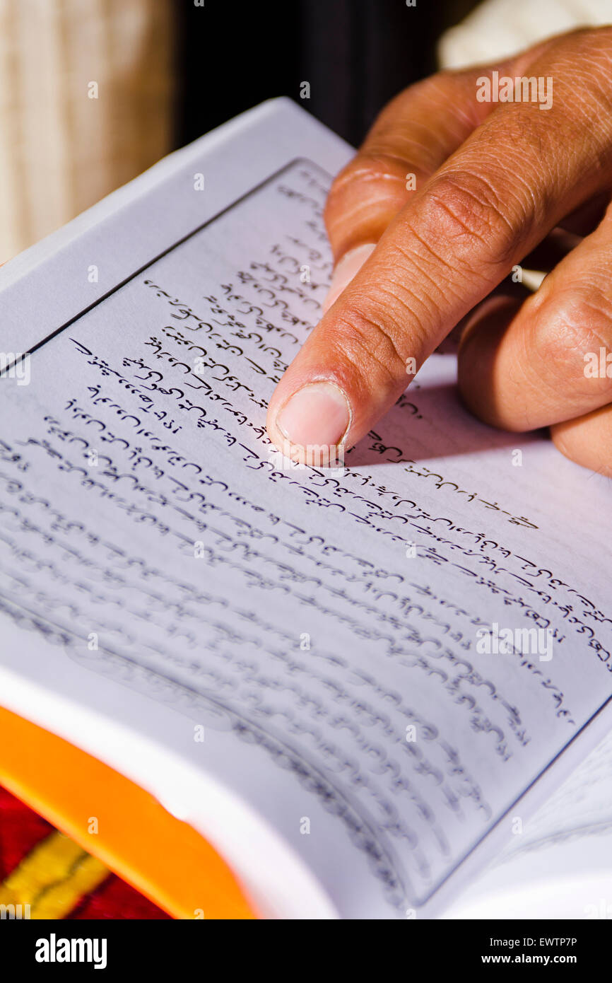 1 Muslim man Reading Quran book Stock Photo - Alamy