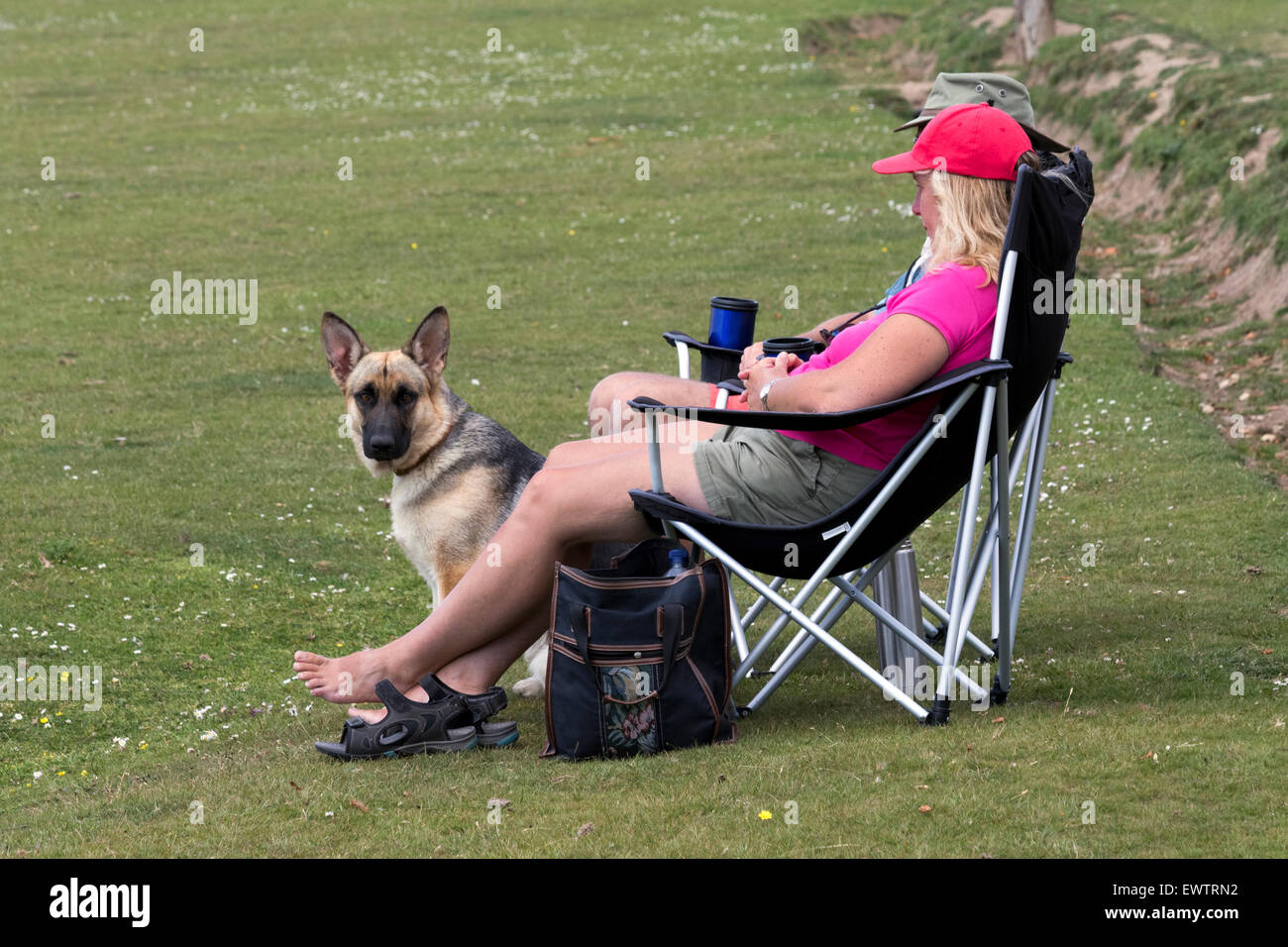 Couple enjoying the English countryside with their alsation dog Stock ...