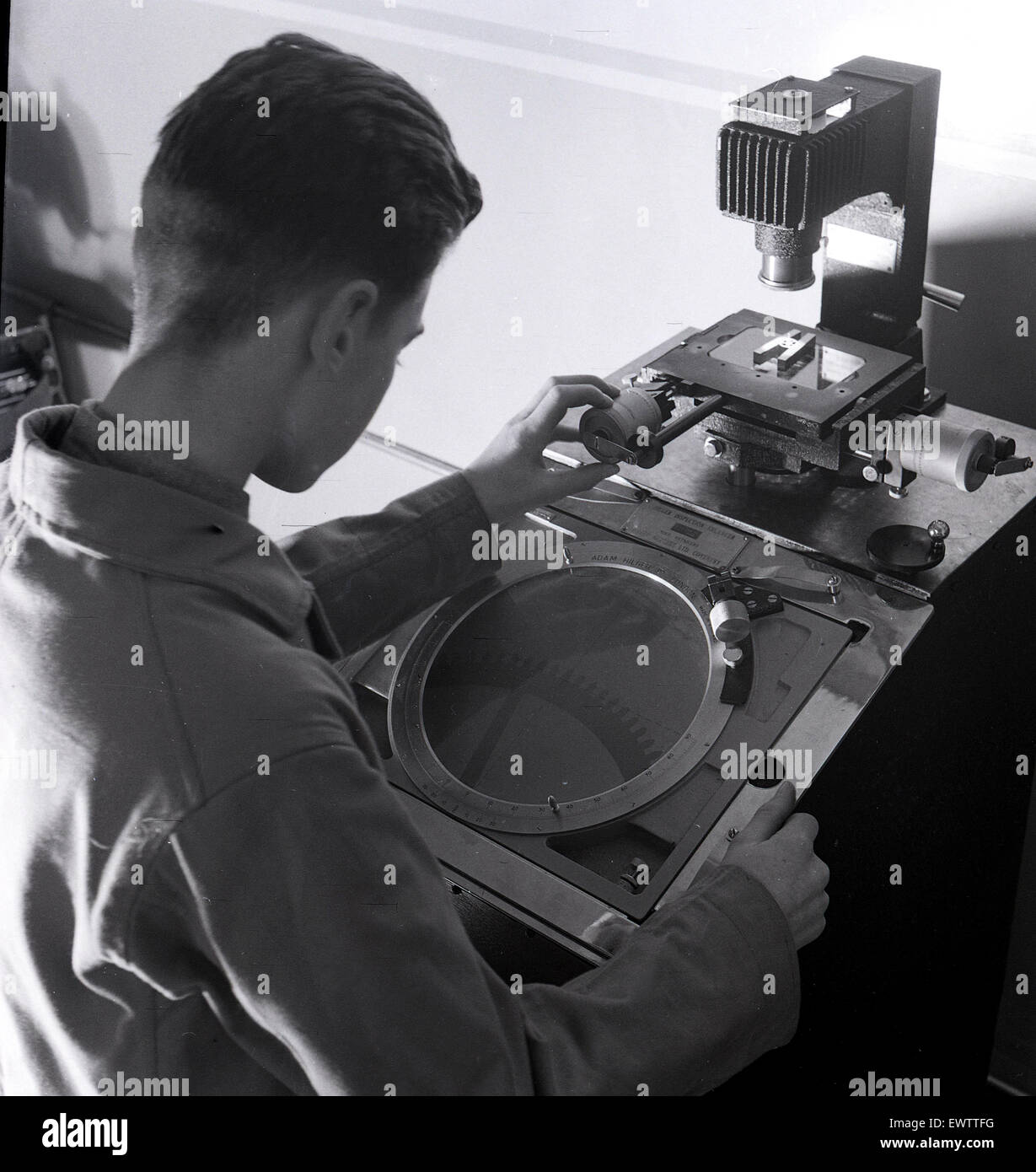 historical, 1950s, young male apprentice engineer using a radiograph ...