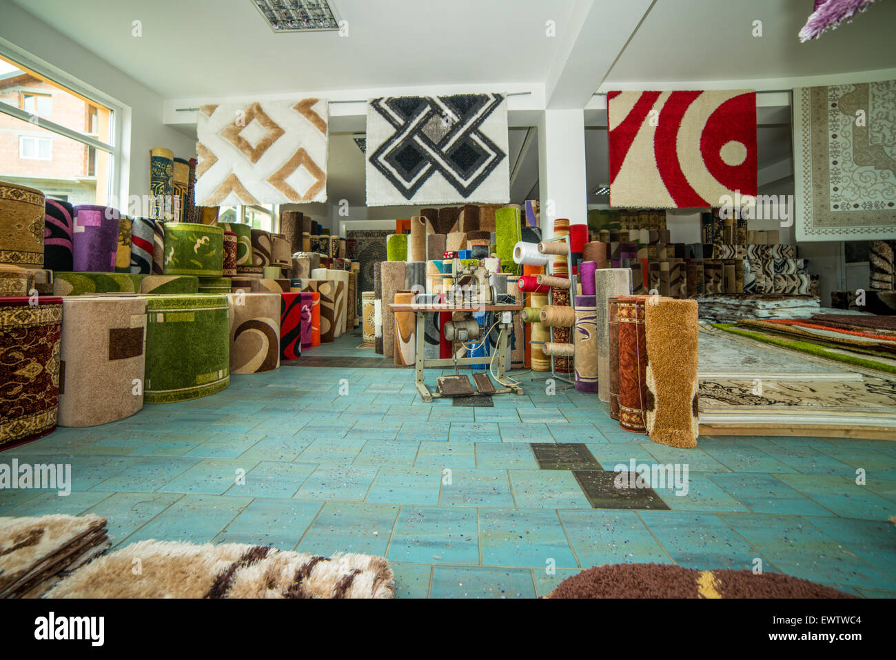 Rolled Rugs Inside A Rug Store Stock Photo - Alamy