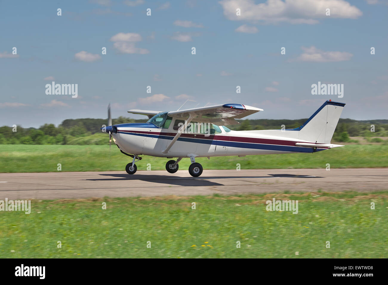 Light plane landing or taking off on the runway on the airfield Stock ...