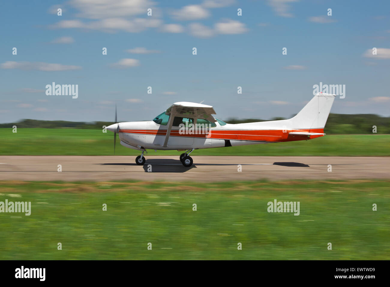 Light plane moving fast along the runway Stock Photo - Alamy