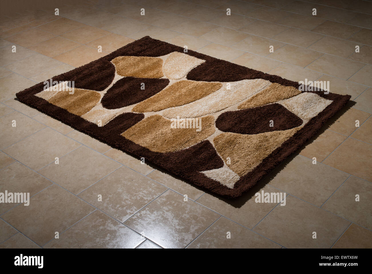 Single Brown Carpet Folded On Floor Stock Photo - Alamy