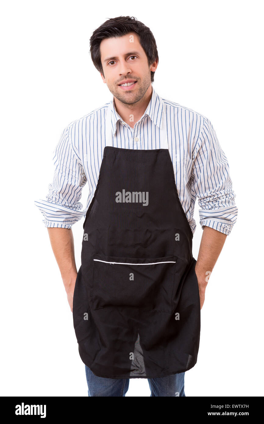 Portrait of handsome young man with apron against white background ...