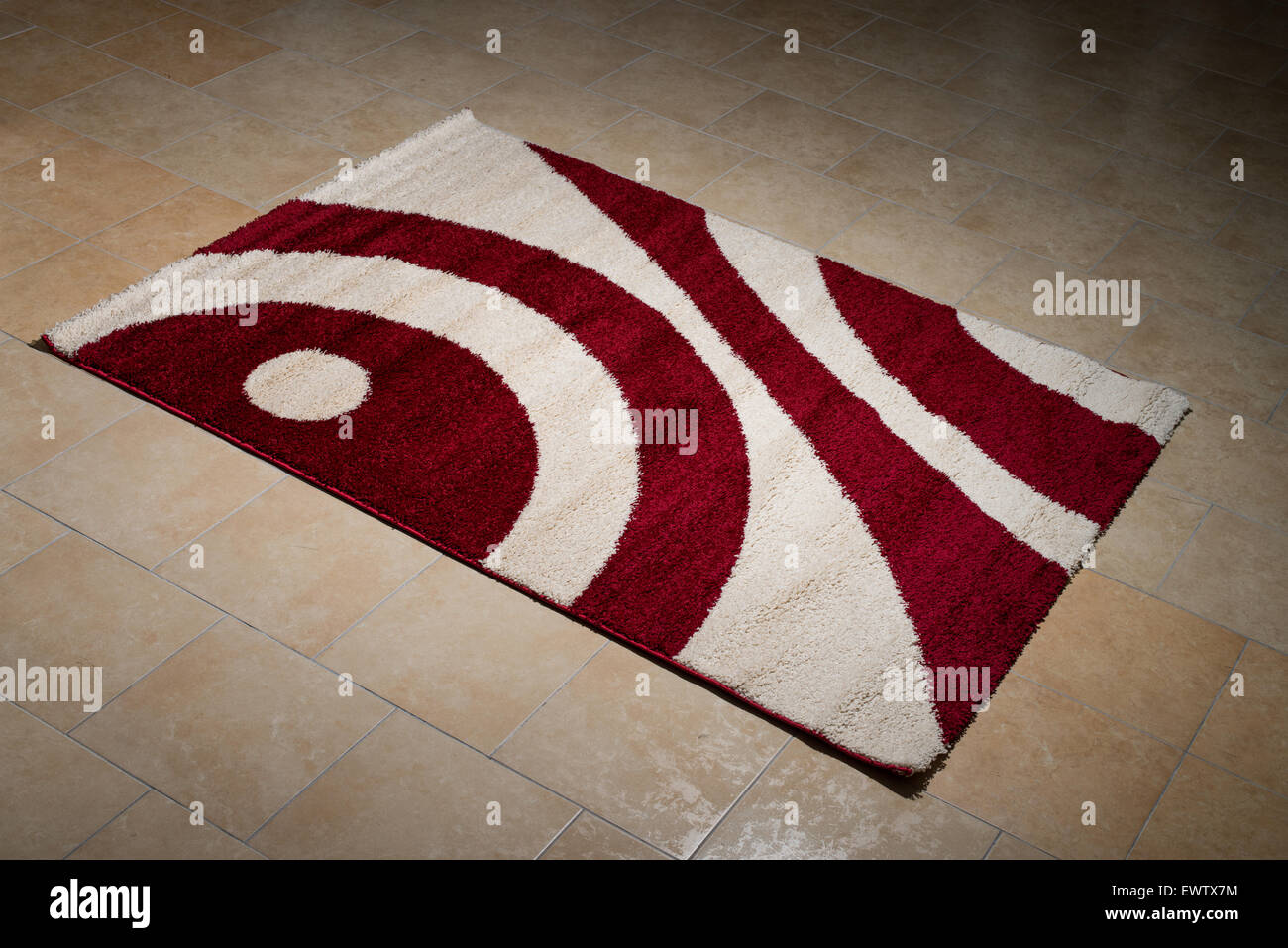 Single Red Carpet Folded On Floor Stock Photo - Alamy