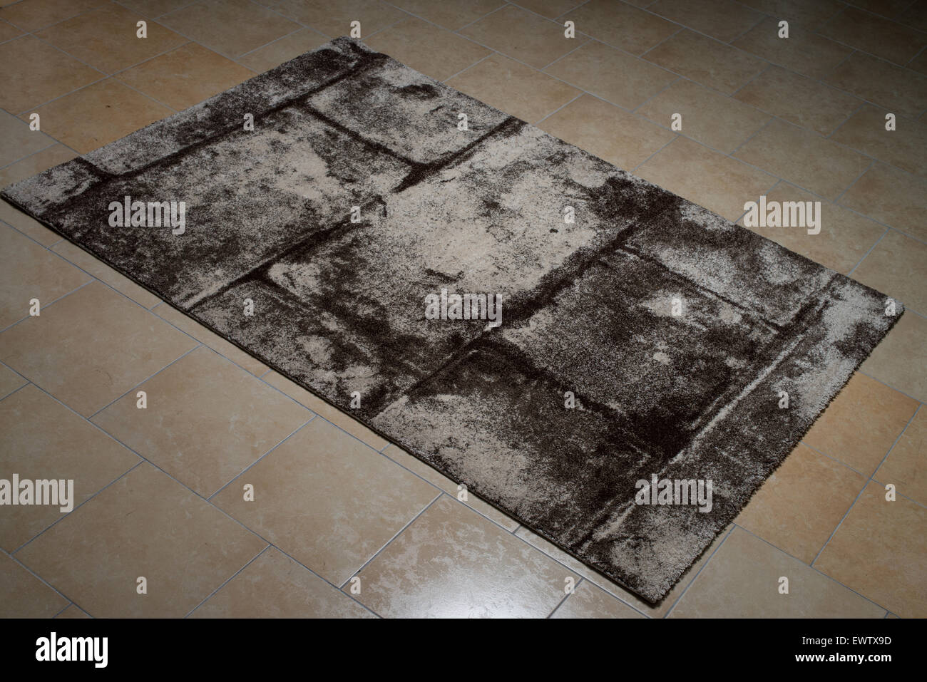 Black Pattern Carpet Lying On Floor Stock Photo - Alamy