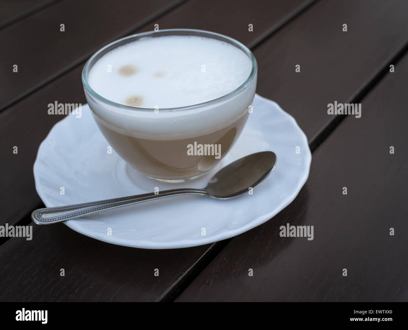 Single cup of smooth roasted coffee using a white cup on brown wood ...