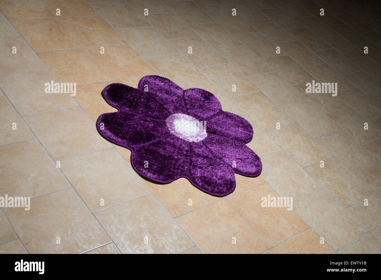 Single Purple Carpet Folded On Floor Stock Photo - Alamy