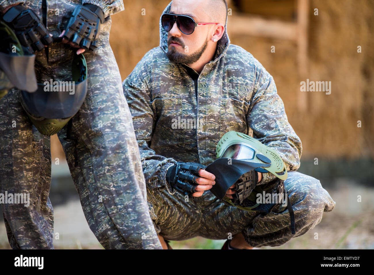 Players in paintball prepare for fight Stock Photo - Alamy