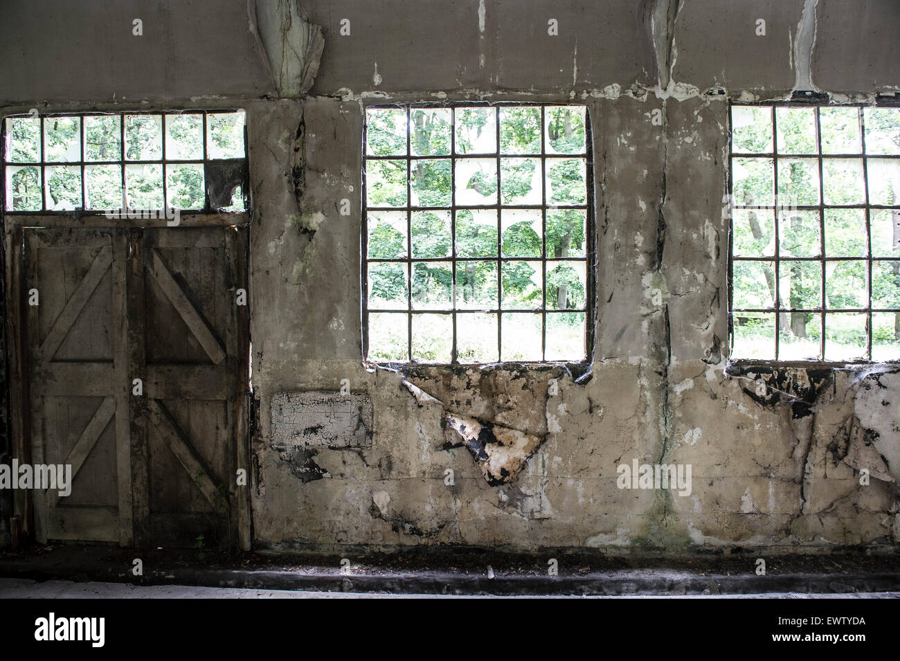 Broken windows on a derelict building Stock Photo - Alamy