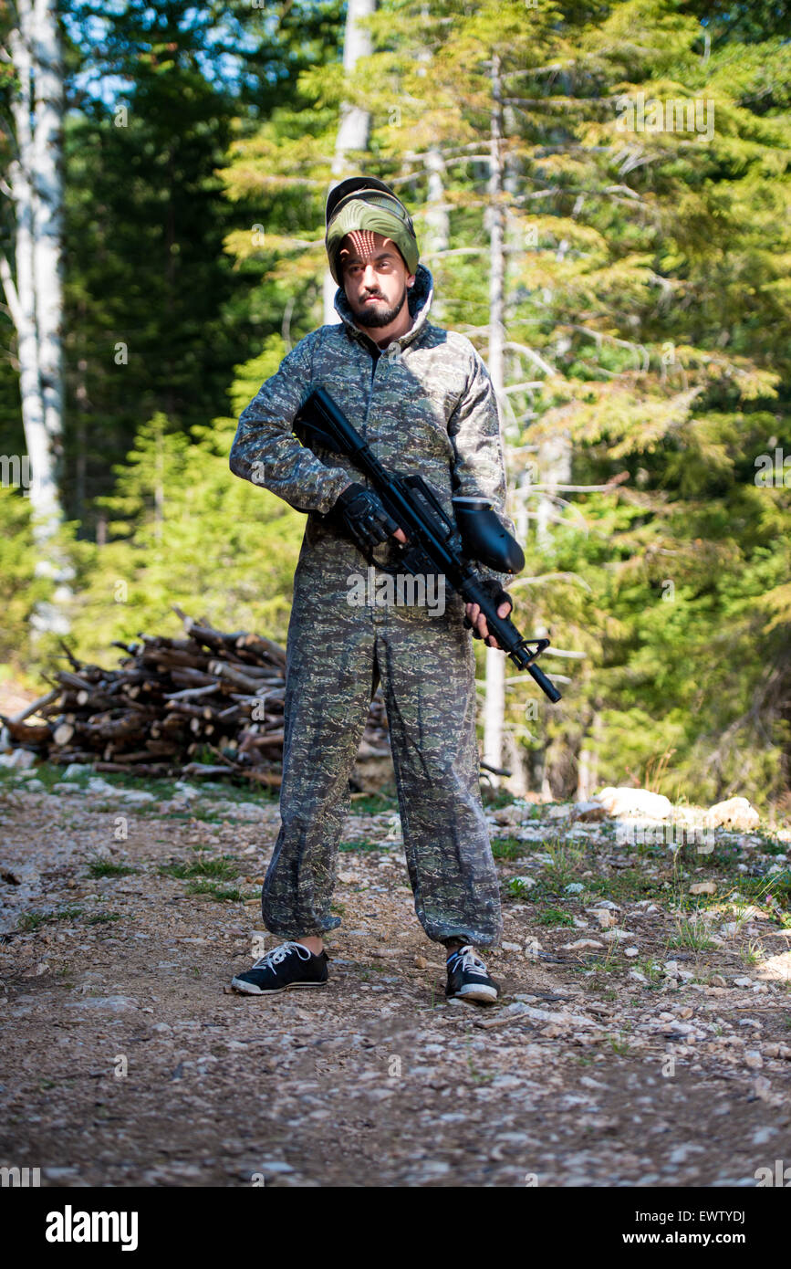 Players in paintball prepare for fight Stock Photo - Alamy