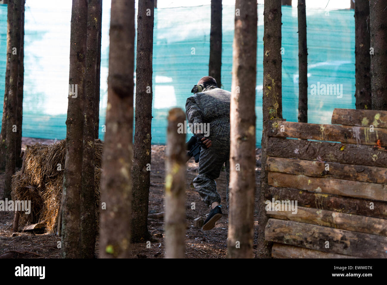 paintball player running away Stock Photo - Alamy