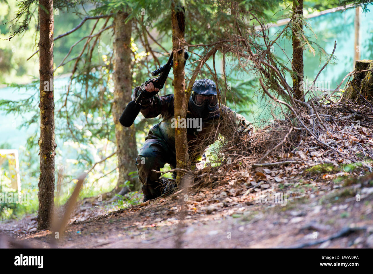 Players in paintball prepare for fight Stock Photo - Alamy