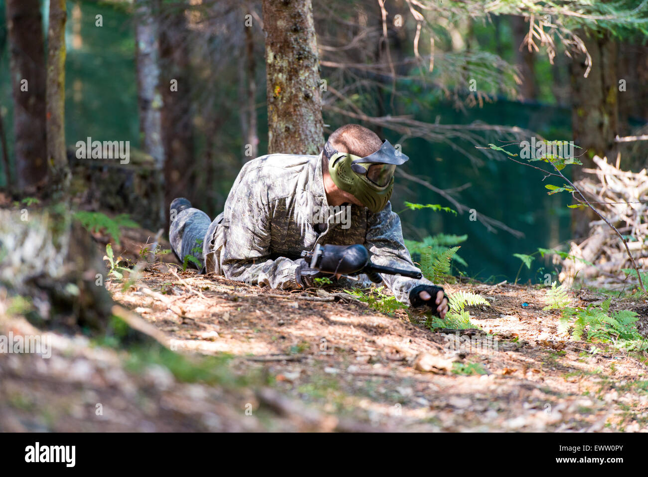 Players in paintball prepare for fight Stock Photo - Alamy