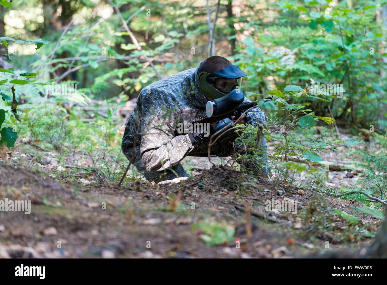 Players in paintball prepare for fight Stock Photo - Alamy