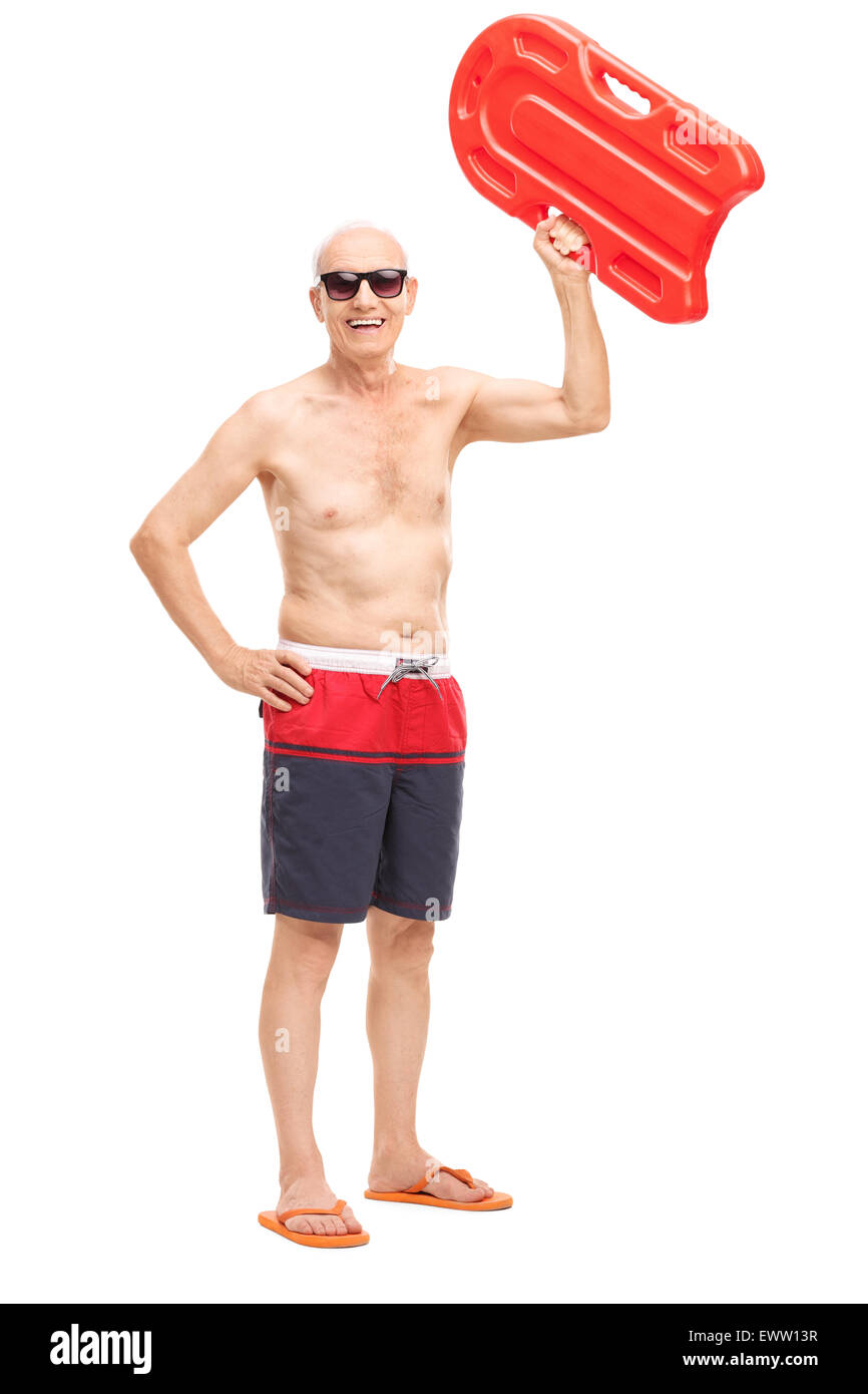 Full length portrait of a shirtless senior holding a swimming float up ...