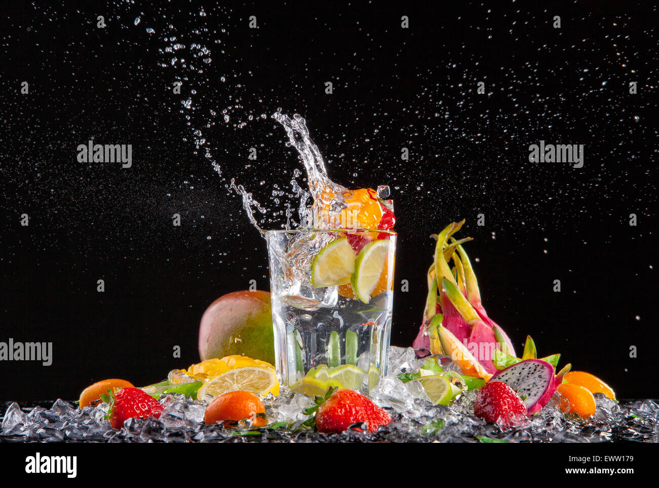 Exotic drink with splash, isolated on black background Stock Photo - Alamy