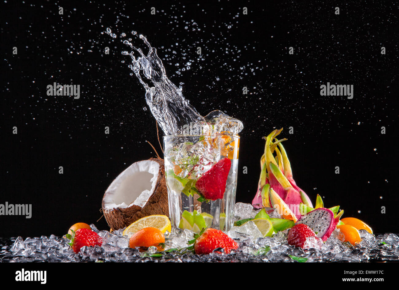 Exotic drink with splash, isolated on black background Stock Photo - Alamy