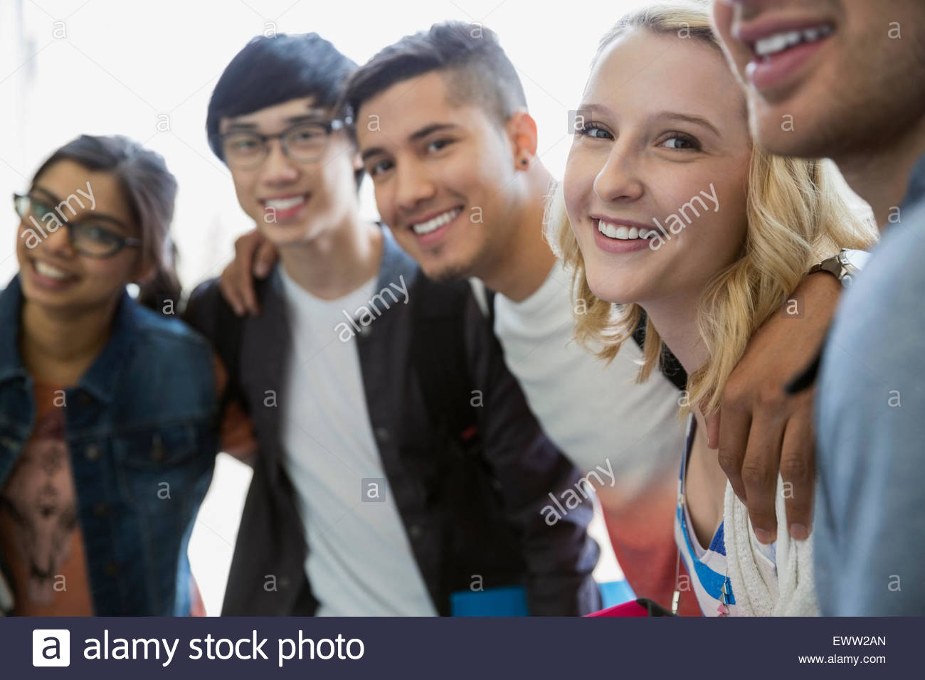 Portrait smiling college students bonding Stock Photo - Alamy